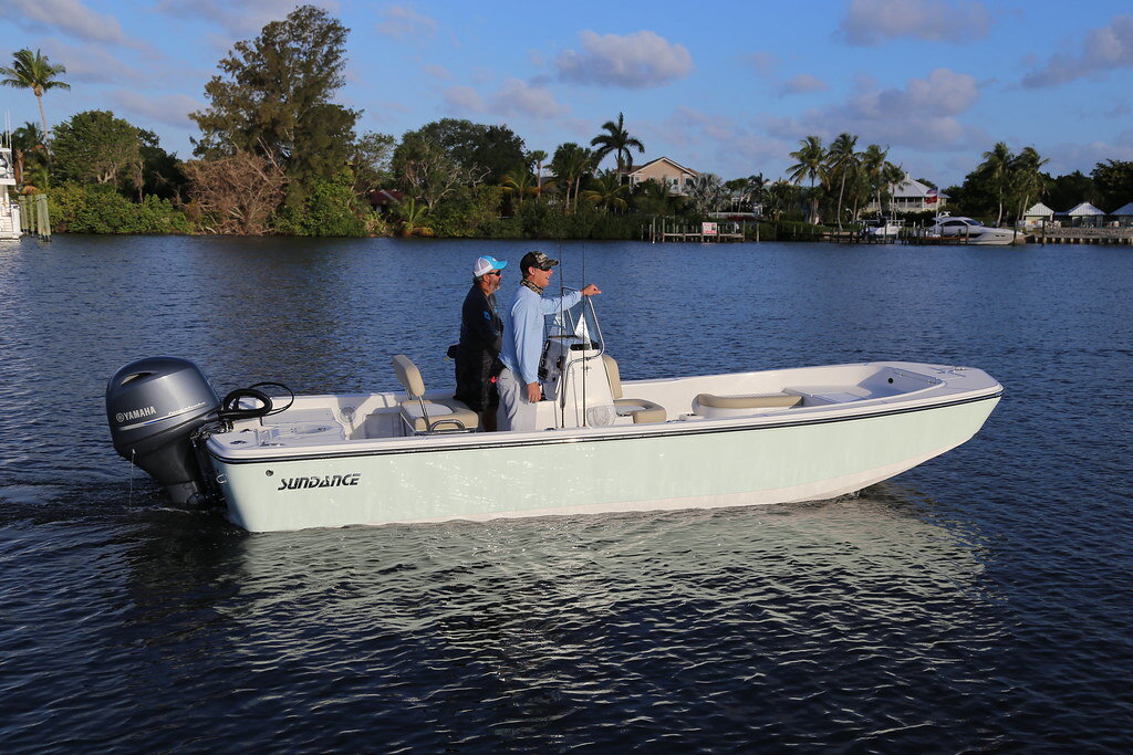 Sundance skiff boat on calm waterway